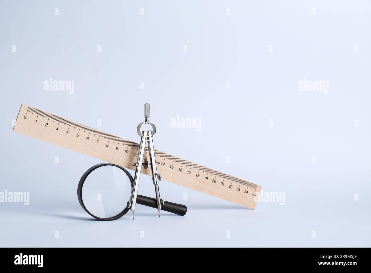Ruler, magnifying glass and compass on white background Stock Photo - Alamy