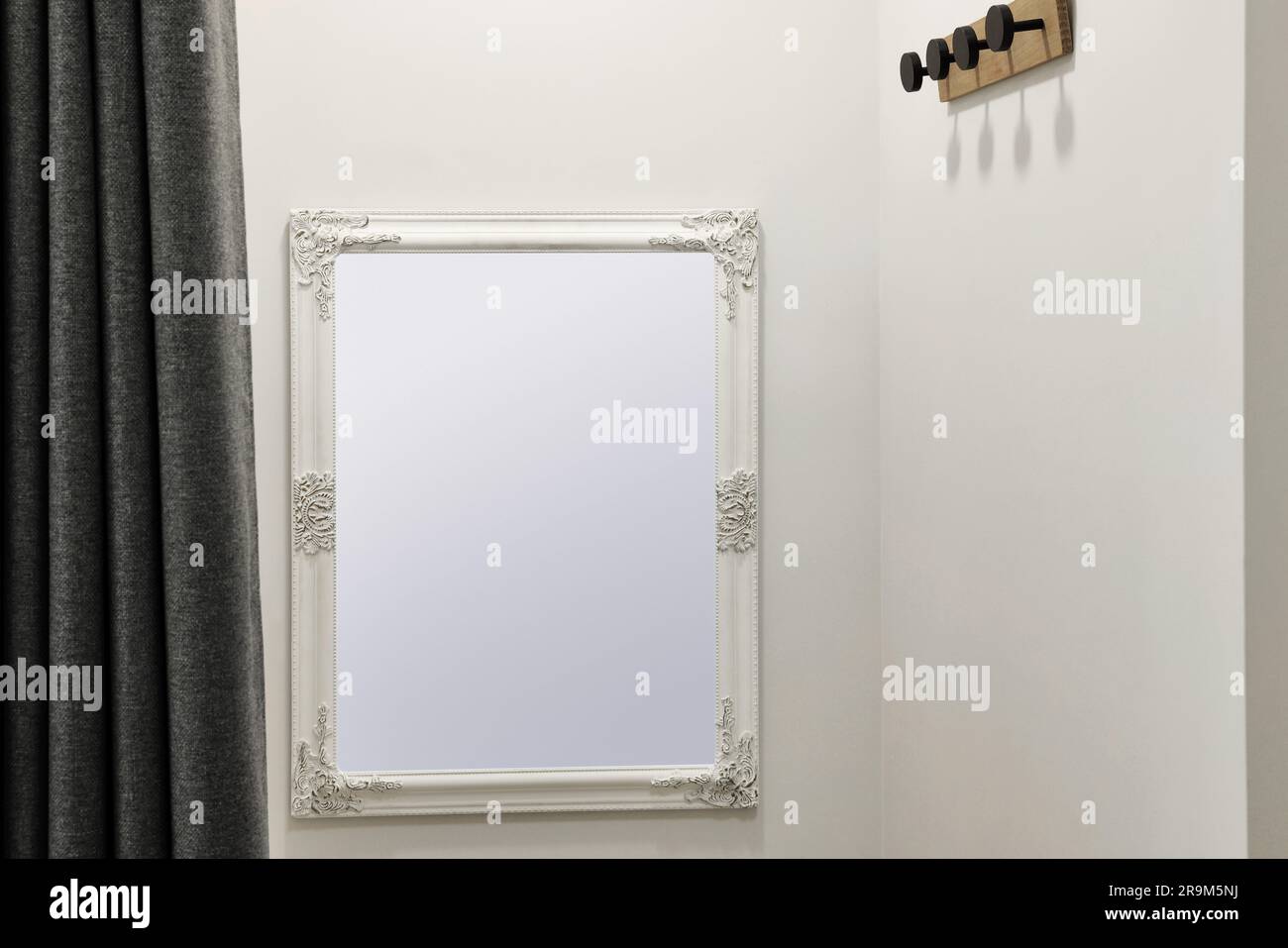 Dressing room with mirror in fashion store. Stylish design Stock Photo ...