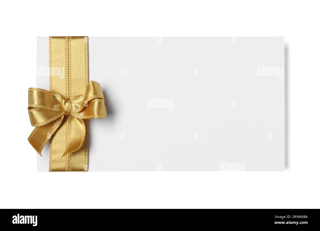 Blank gift card with golden bow isolated on white, top view Stock Photo ...