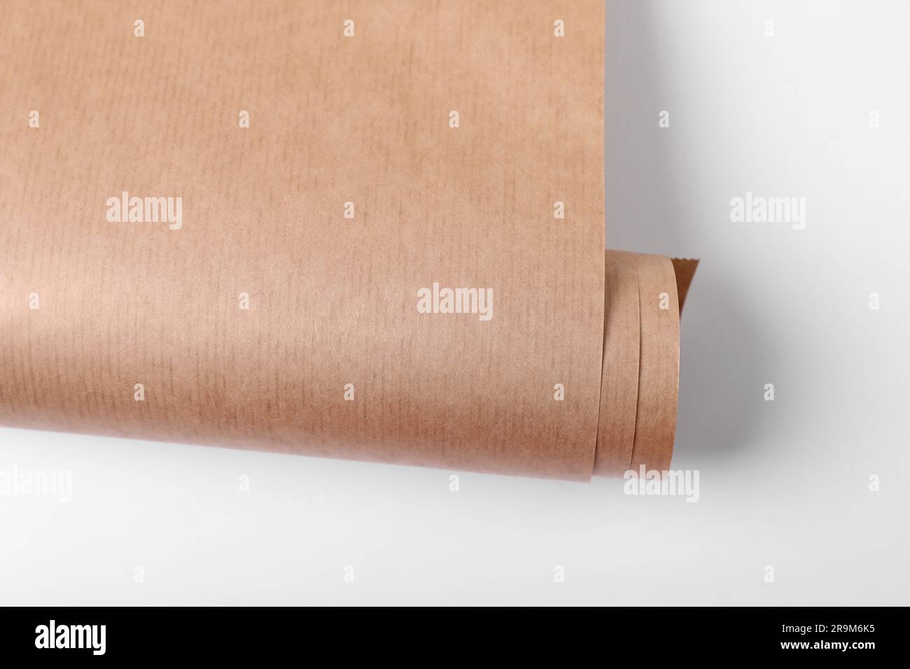 Roll of wrapping paper on white background, top view Stock Photo - Alamy