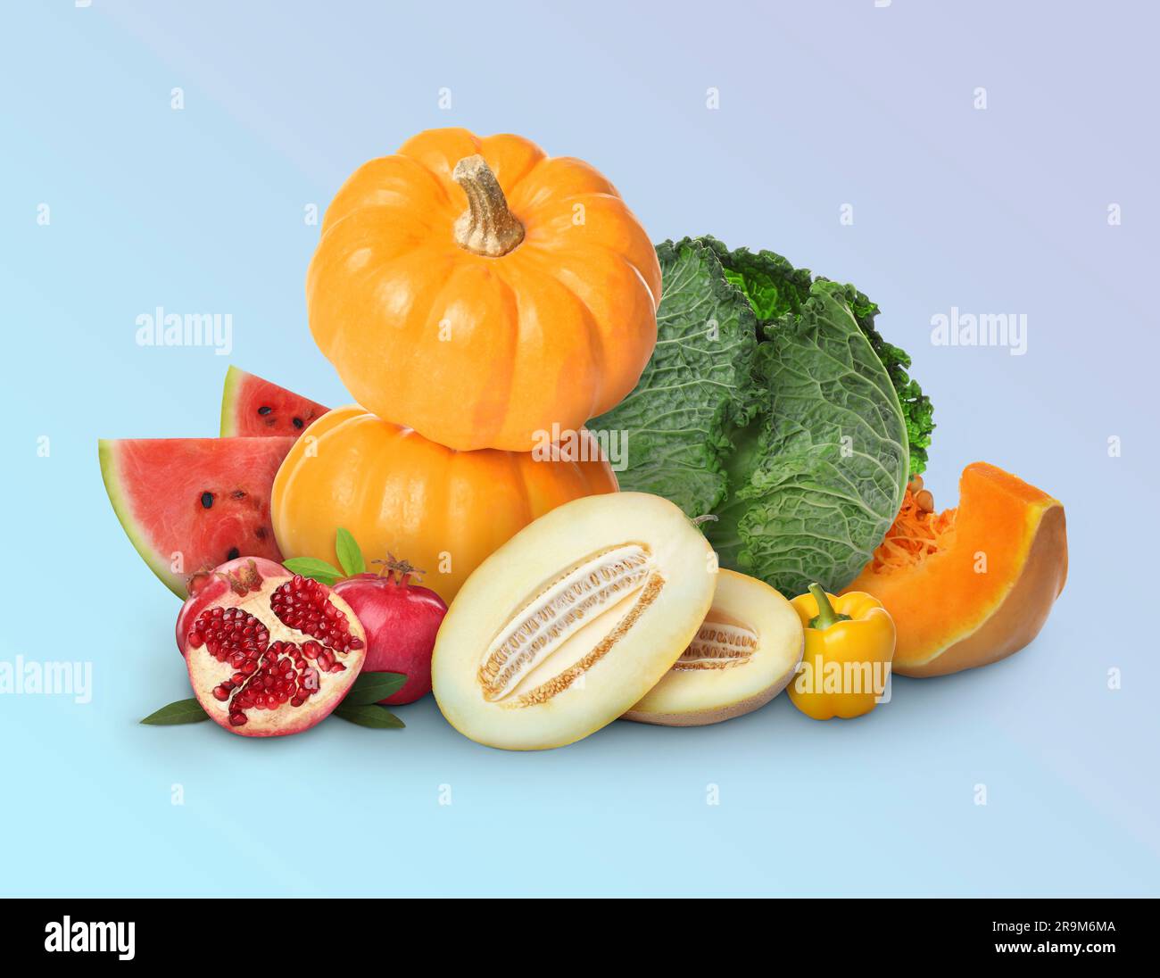Fresh fruits and vegetables on pale light blue gradient background ...