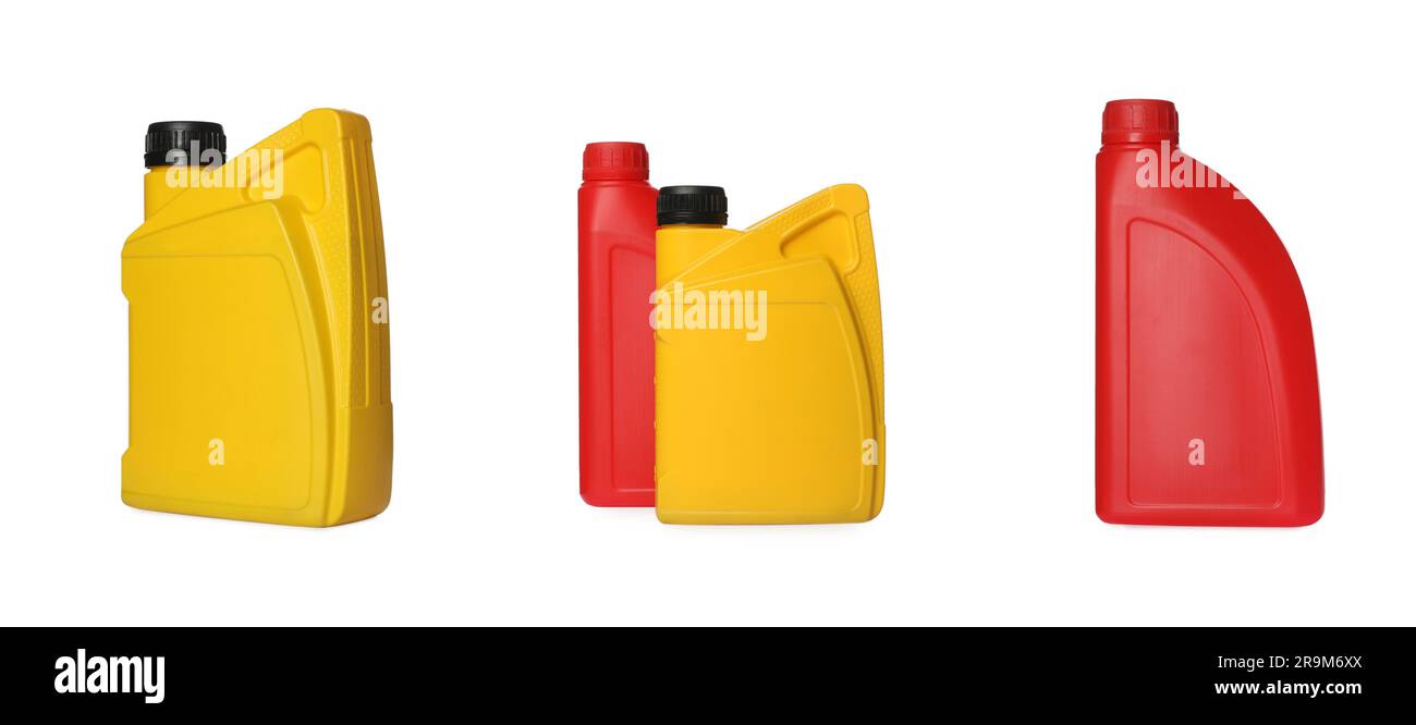 Colorful containers with different motor oil on white background ...