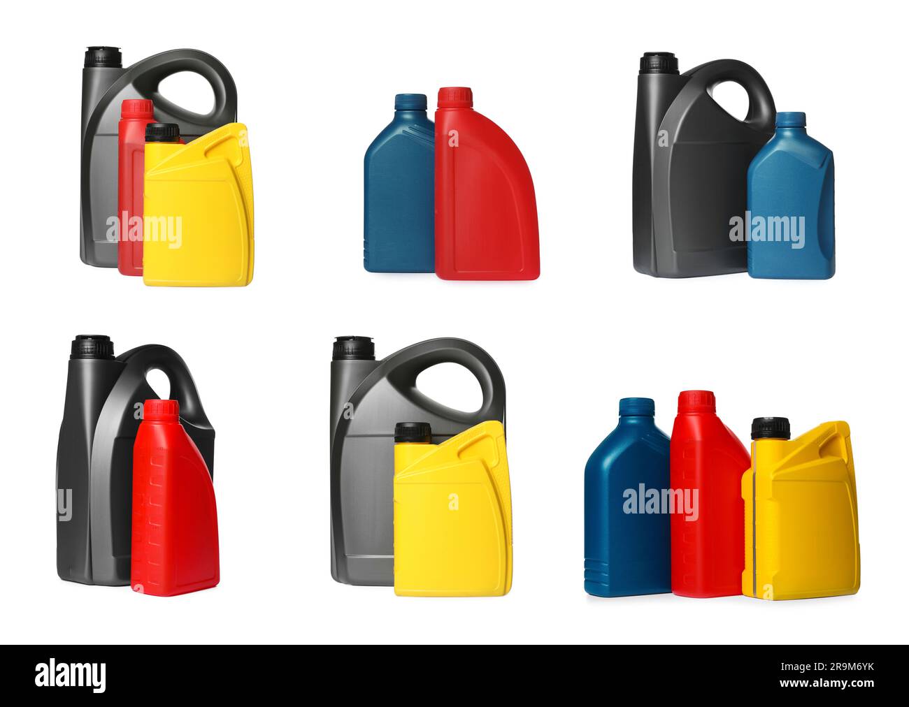 Colorful containers with different motor oil on white background ...