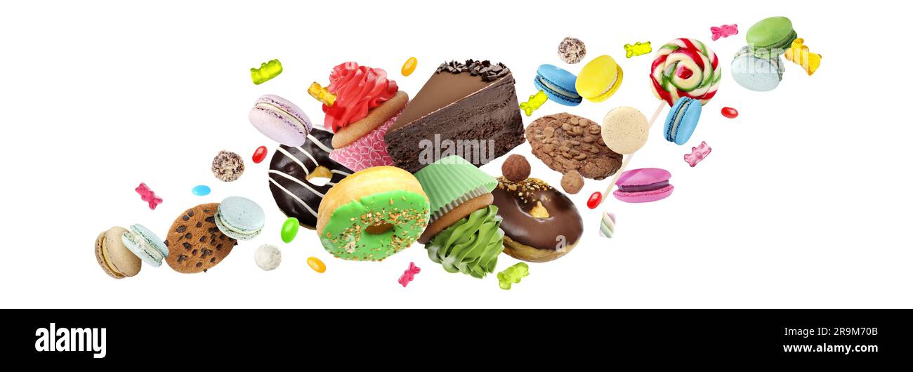 Many delicious sweets falling on white background Stock Photo - Alamy