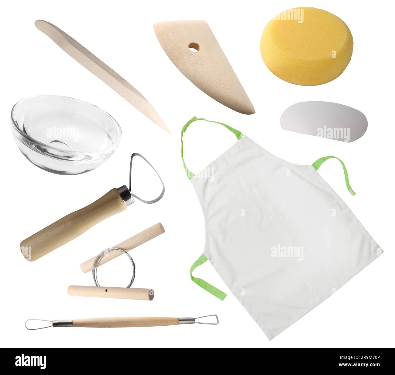 Set of pottery tools, apron and glass bowl on white background Stock ...