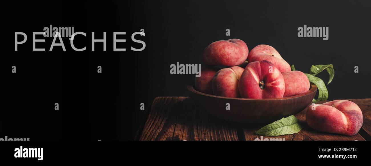 Fresh flat peaches on table against black background, banner design ...