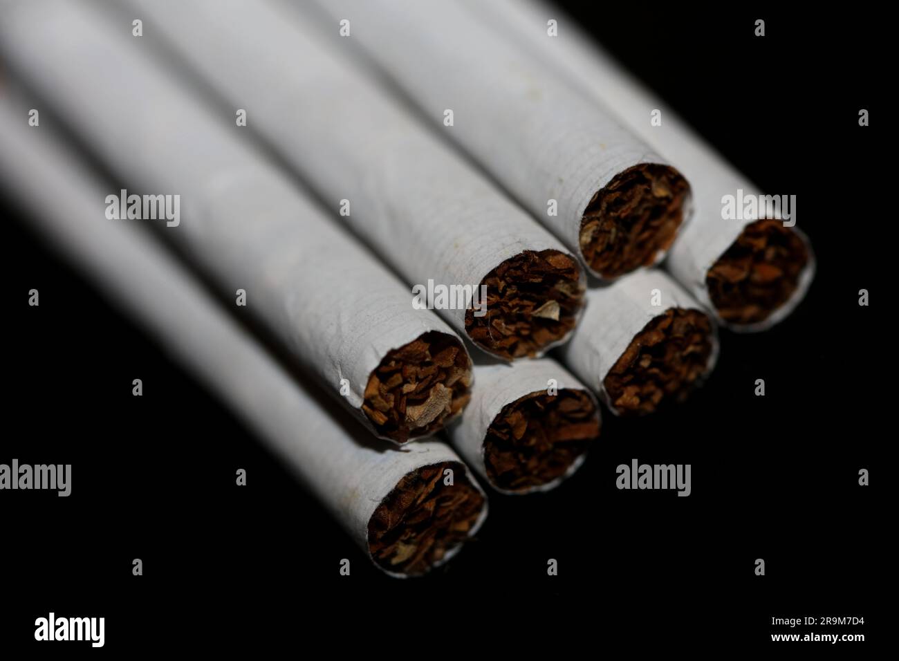 A view from a number of cigarettes isolated on black background tobacco ...