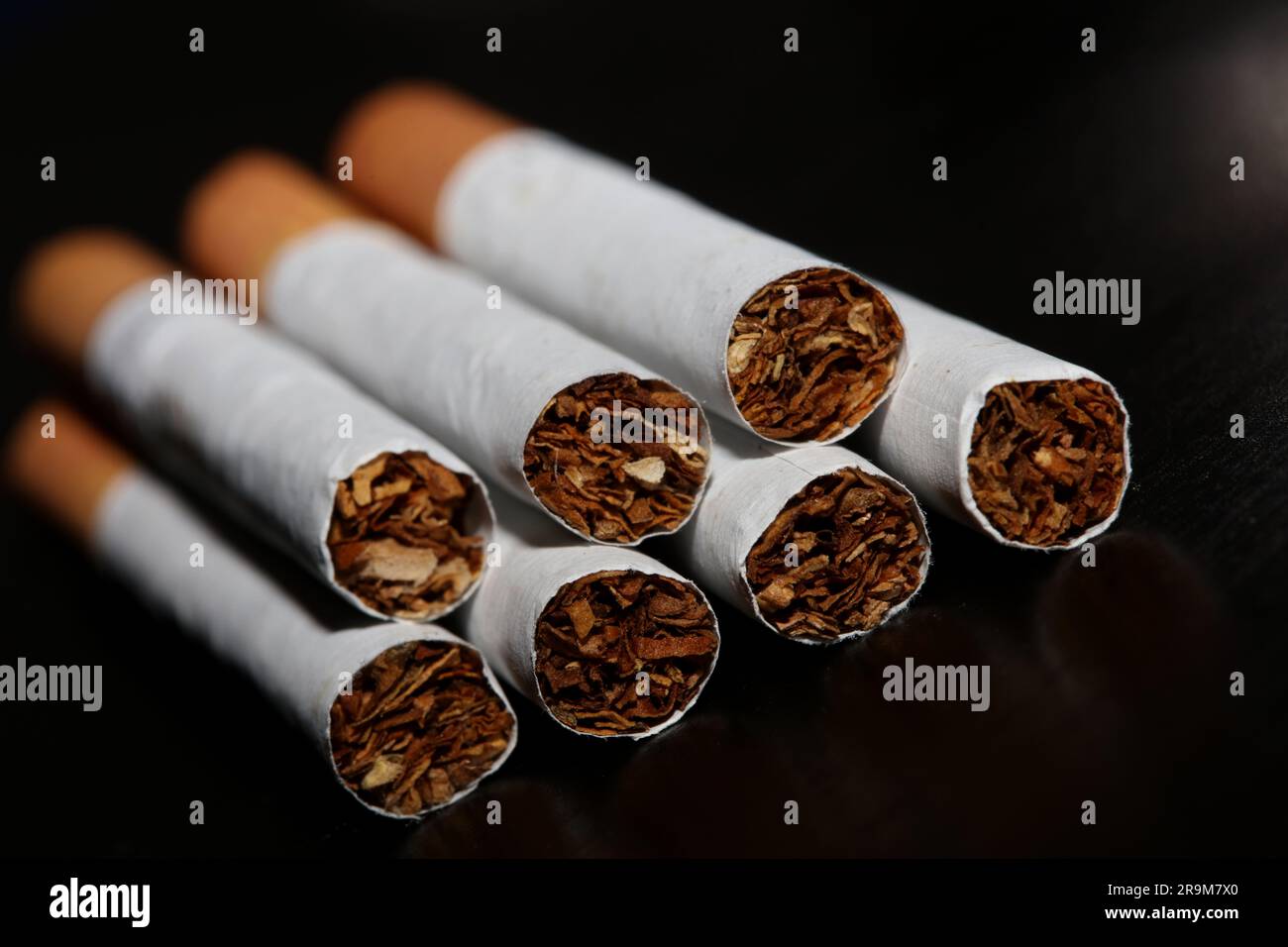 A view from a number of cigarettes isolated on black background tobacco ...