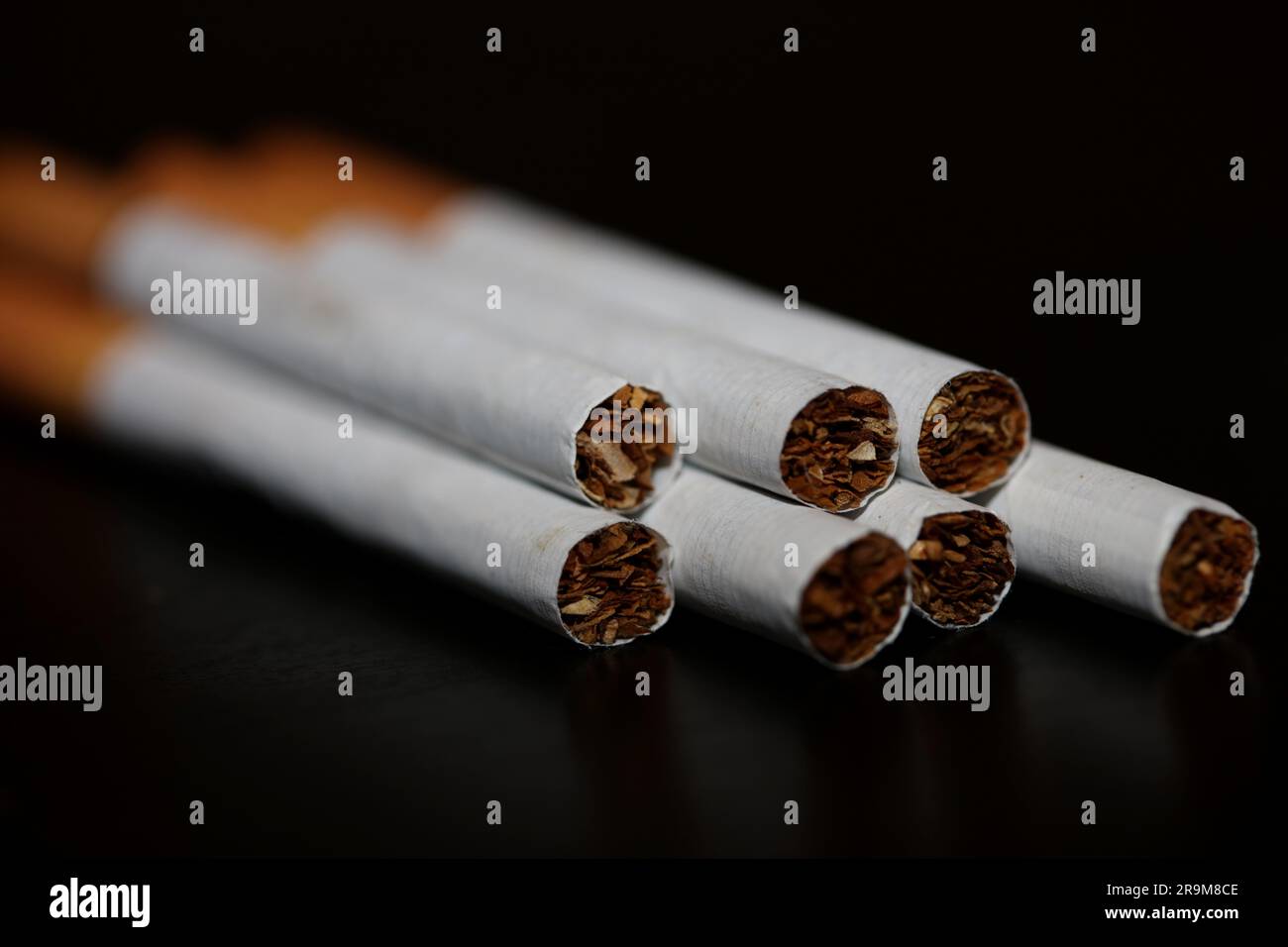 A view from a number of cigarettes isolated on black background tobacco ...