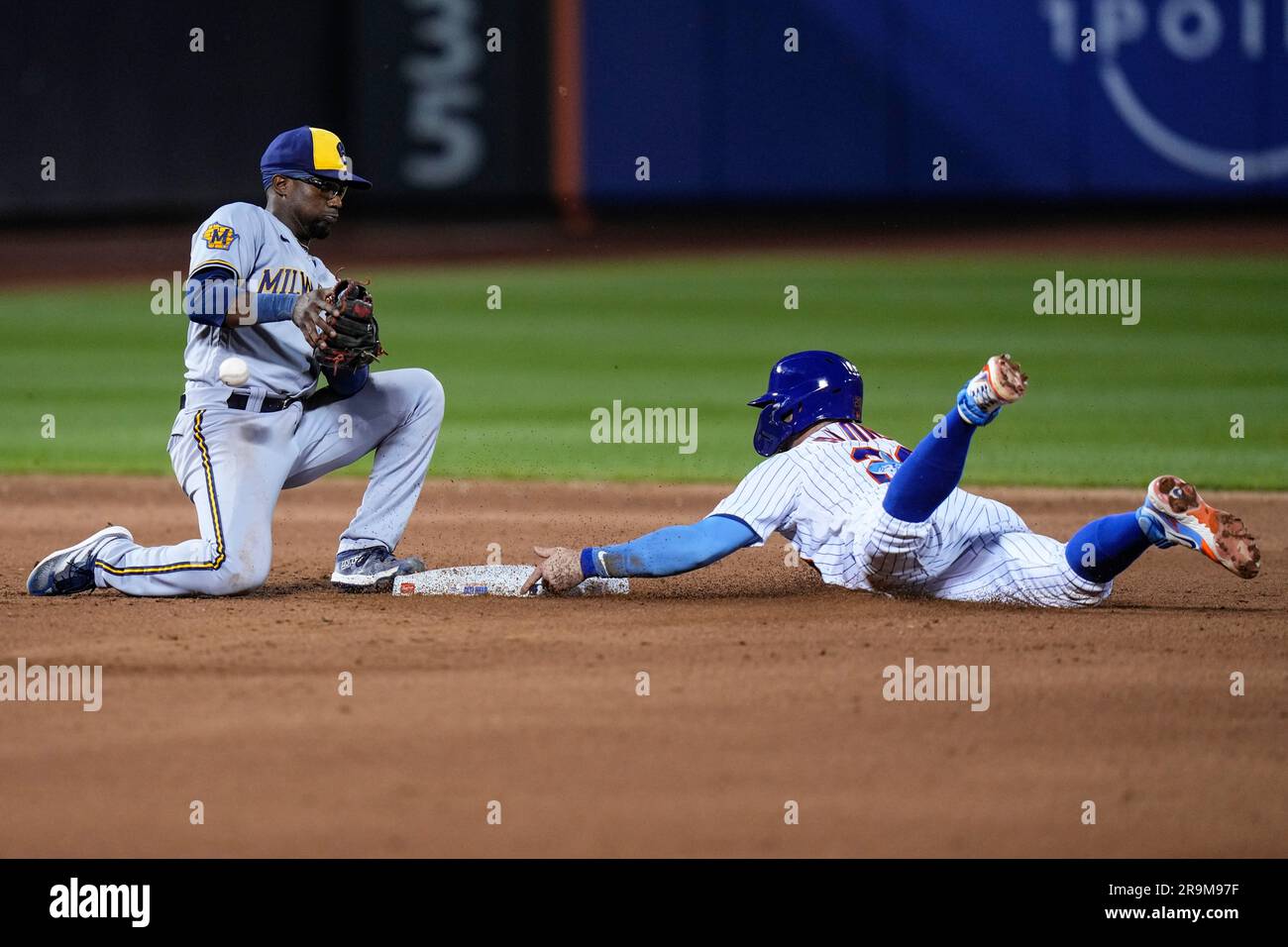 Milwaukee Brewers second baseman Andruw Monasterio, left, loses control ...
