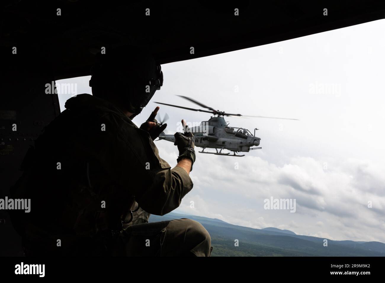U.S. Marine Corps Cpl. Rylan Wolfe, a UH-1Y helicopter crew chief with ...