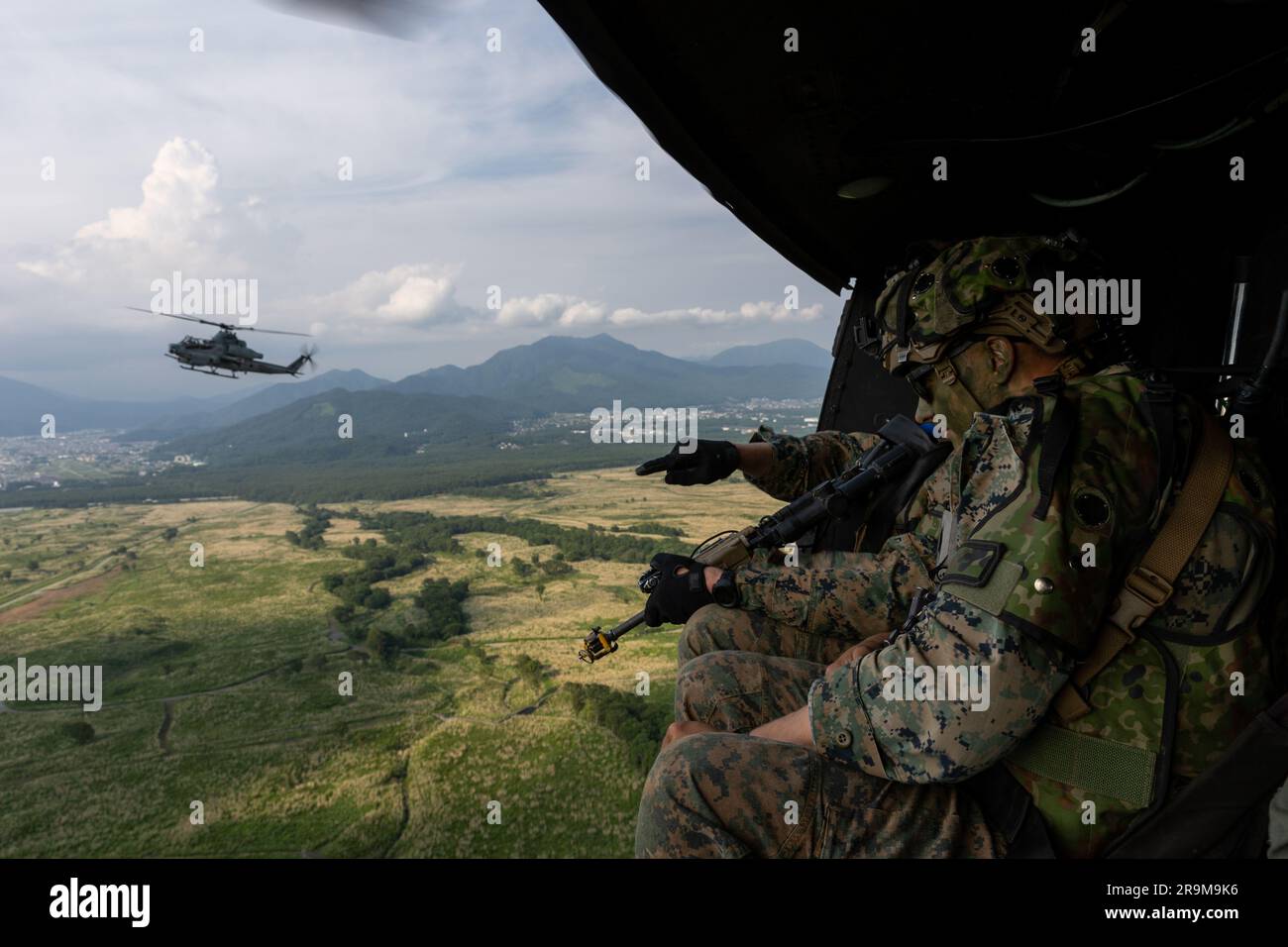 U.S. Marines with 3rd Reconnaissance Battalion identify targets during ...
