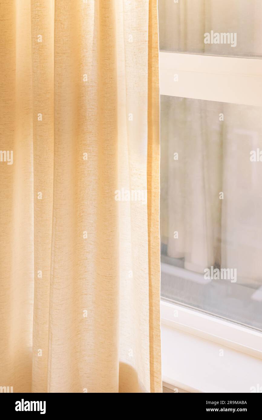 Natural linen beige curtain in morning sunlight, modern home details ...