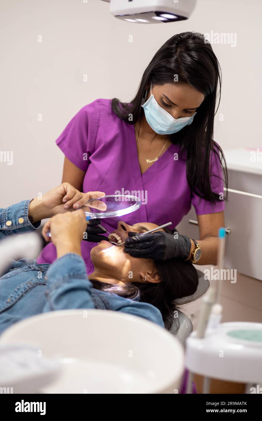 health and wellness, female dentist working with a patient, dental ...