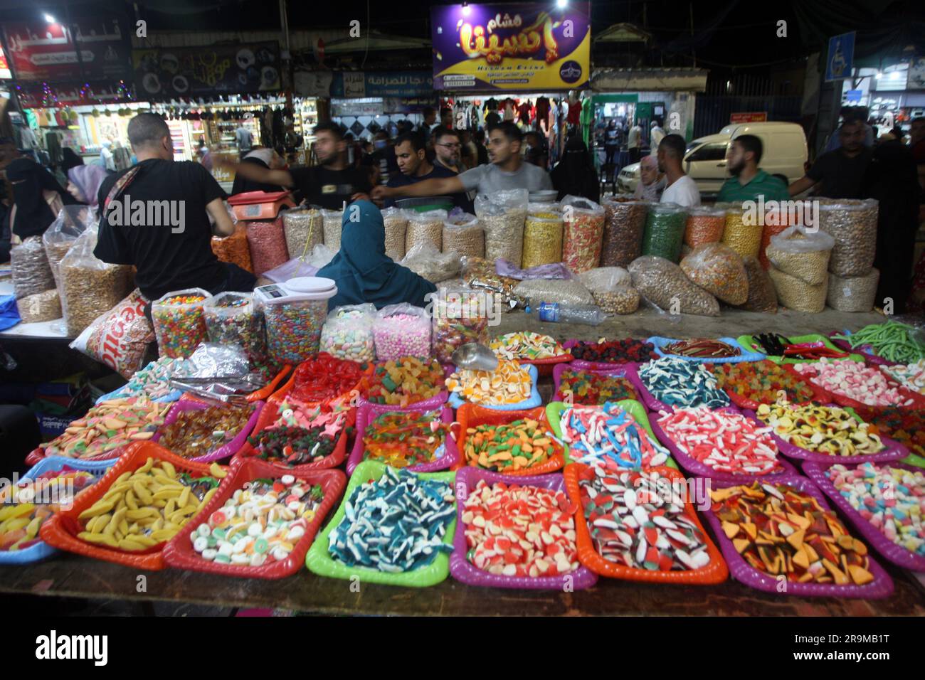Gaza Strip, Gaza, June 27, 2023, Palestinians buy sweets in a popular ...