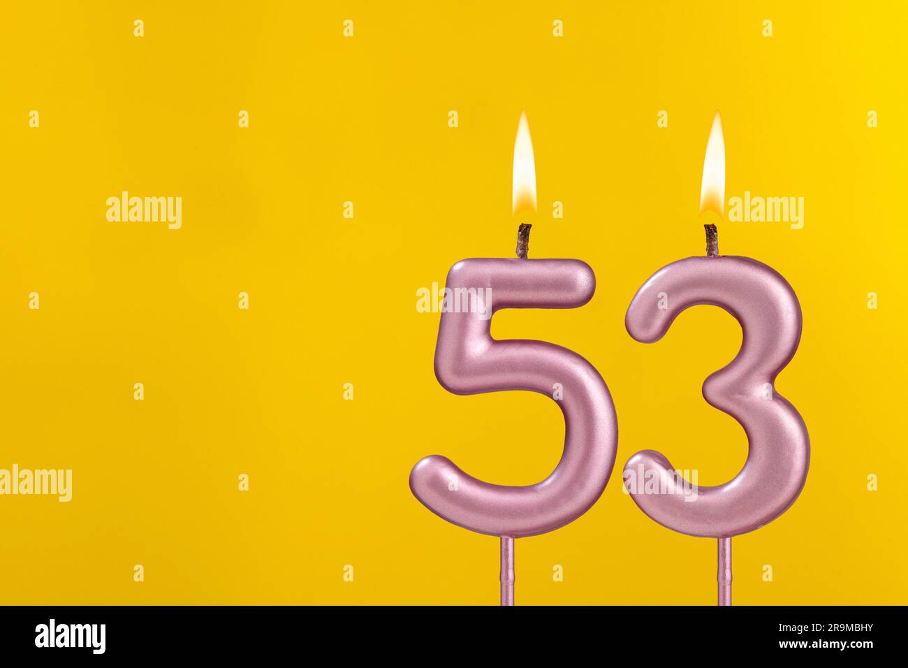 Birthday candle number 53 - Birthday celebration on yellow background ...
