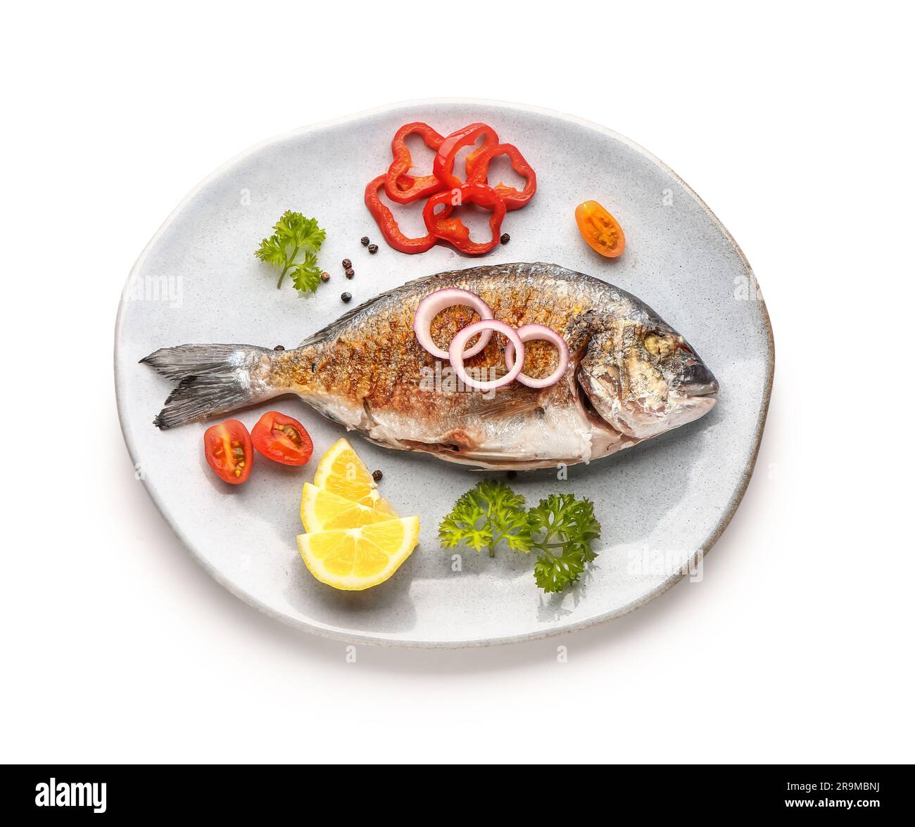 Plate baked dorado fish Cut Out Stock Images & Pictures - Alamy