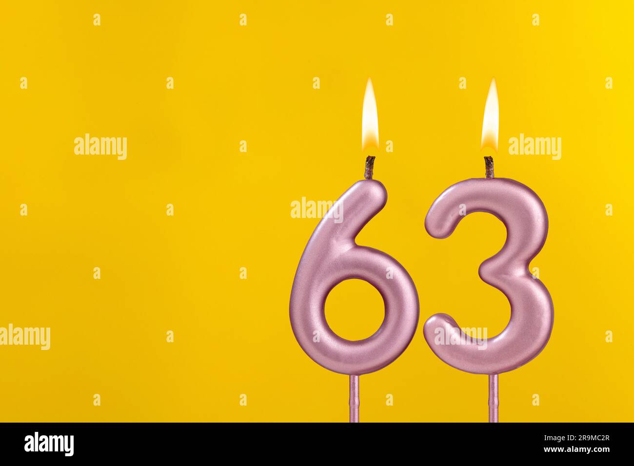 Birthday candle number 63 - Birthday celebration on yellow background ...