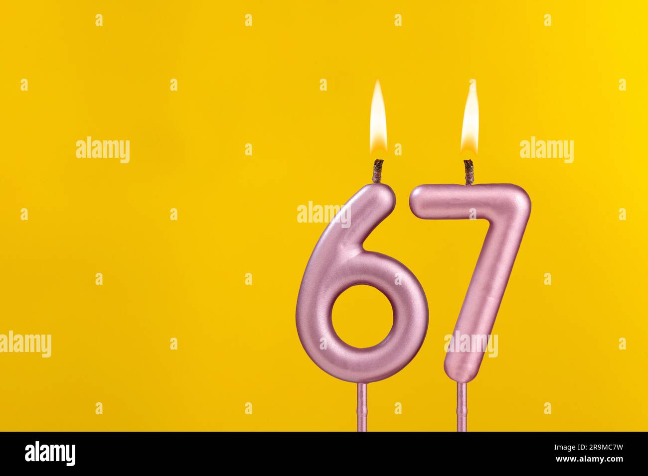Birthday candle number 67 - Birthday celebration on yellow background ...
