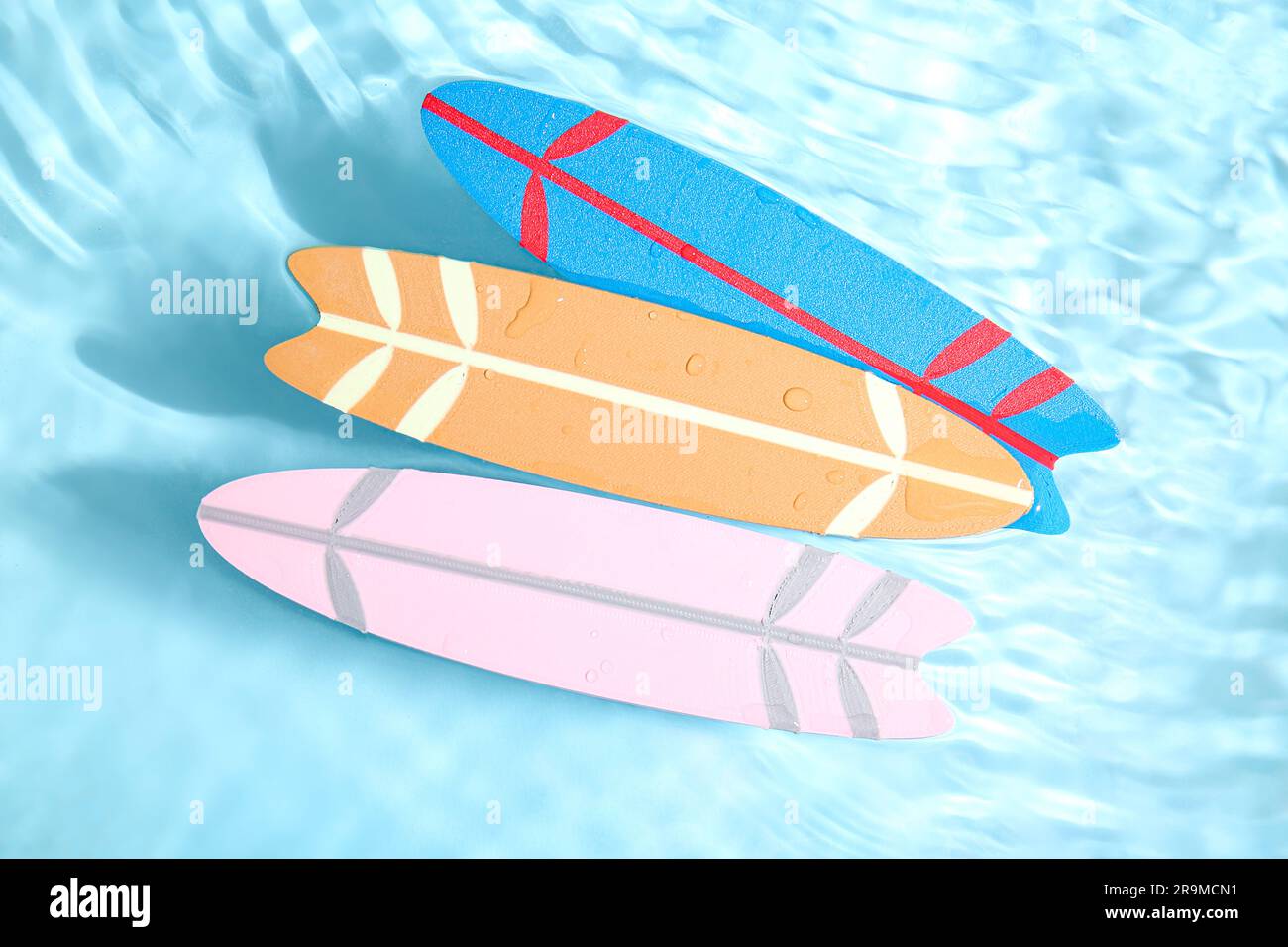Different colorful mini surfboards in water Stock Photo - Alamy