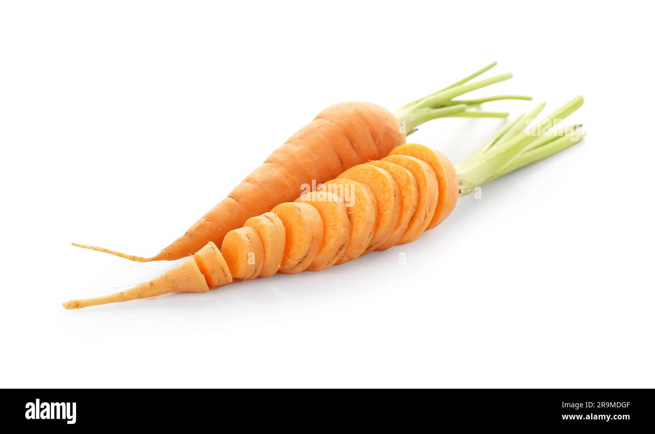 Fresh carrot and slices on white background Stock Photo - Alamy