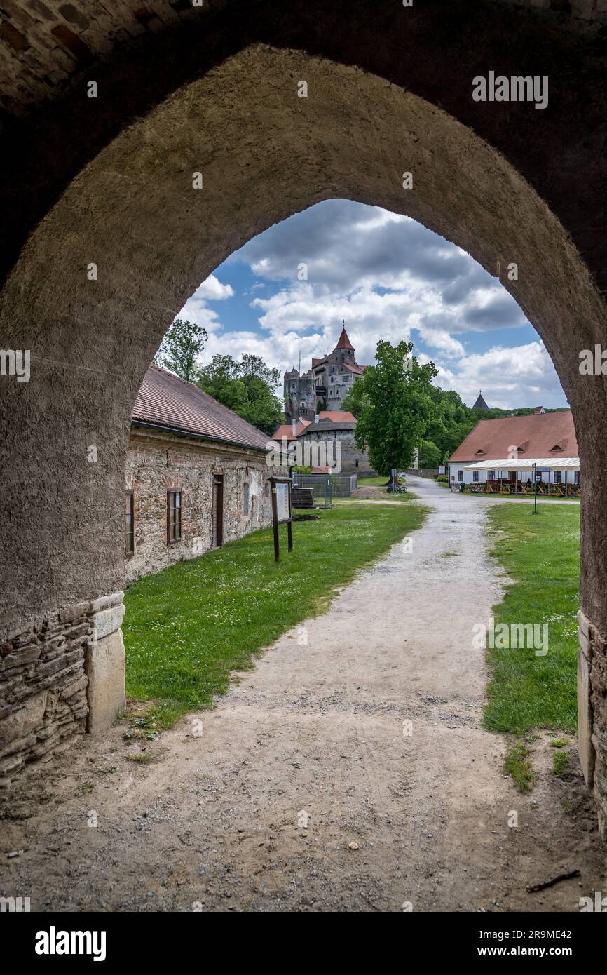 View of the outer courtyard from the arch of the gate at Pernstejn ...
