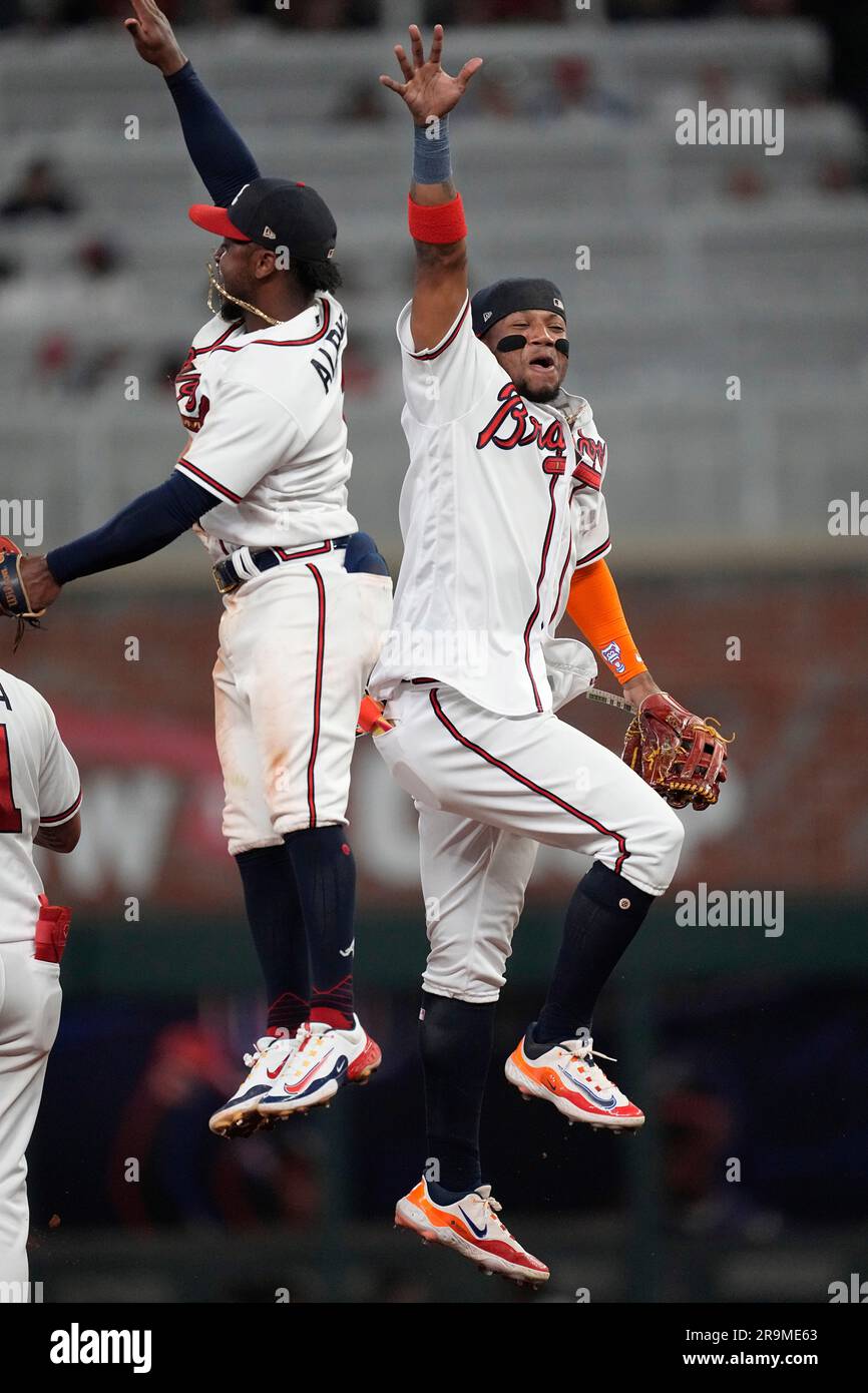 Atlanta Braves' Ozzie Albies, left, and Ronald Acuna Jr. celebrate the ...