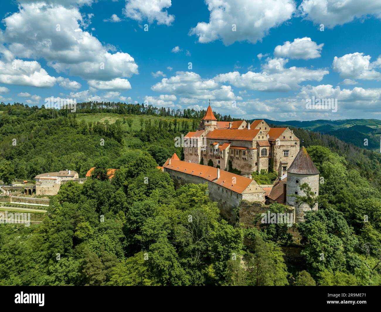 Aerial view of Pernstejn castle with Gothic palace red roof ...
