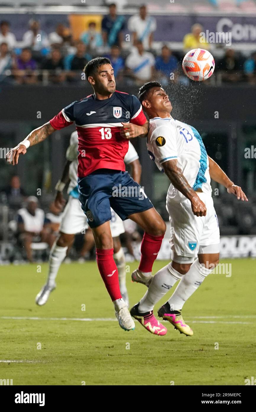 Guatemala midfielder Alejandro Galindo, right, heads the ball as Cuba ...