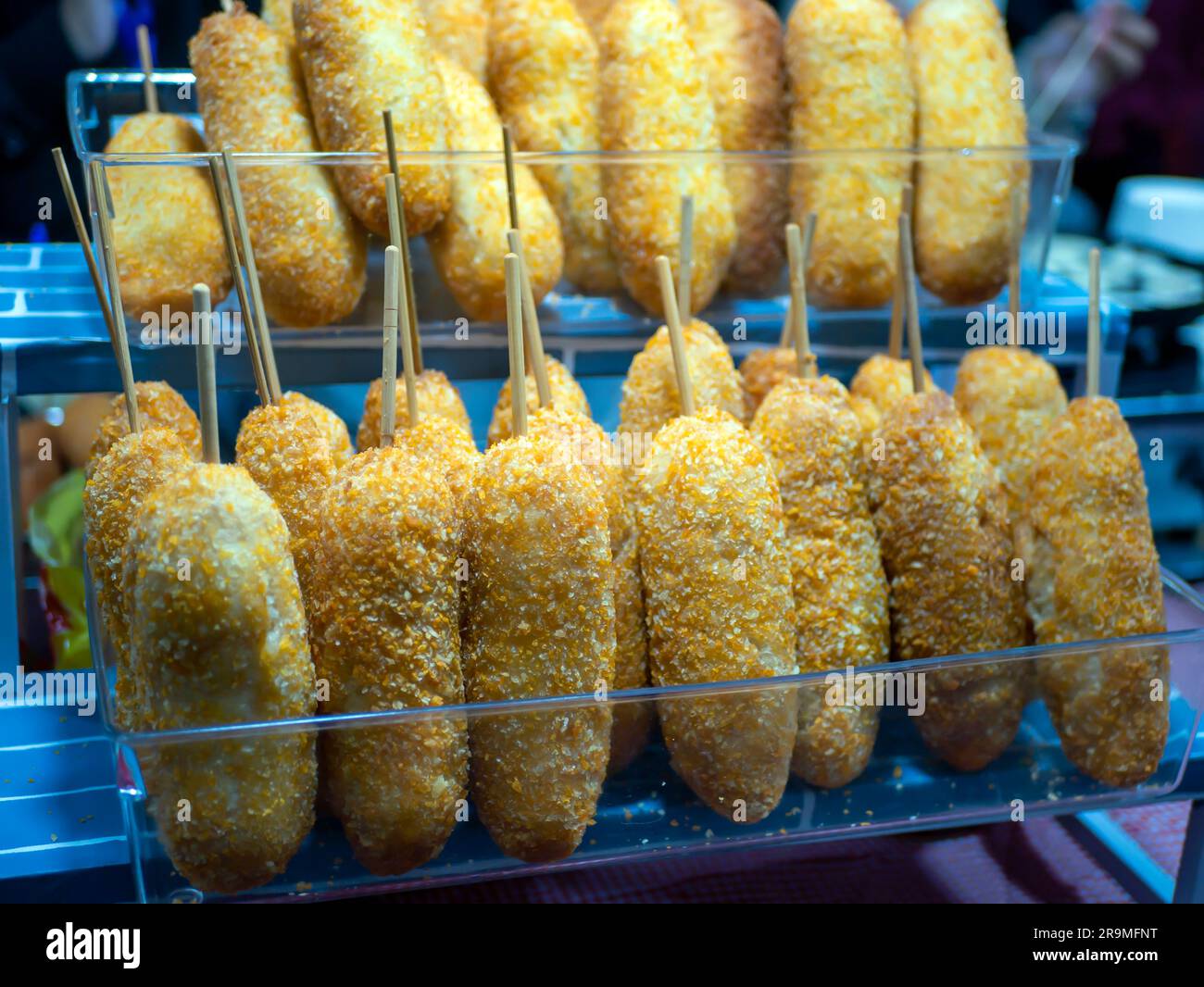 Homemade fried breaded Corn Dogs in a plastic container Stock Photo - Alamy