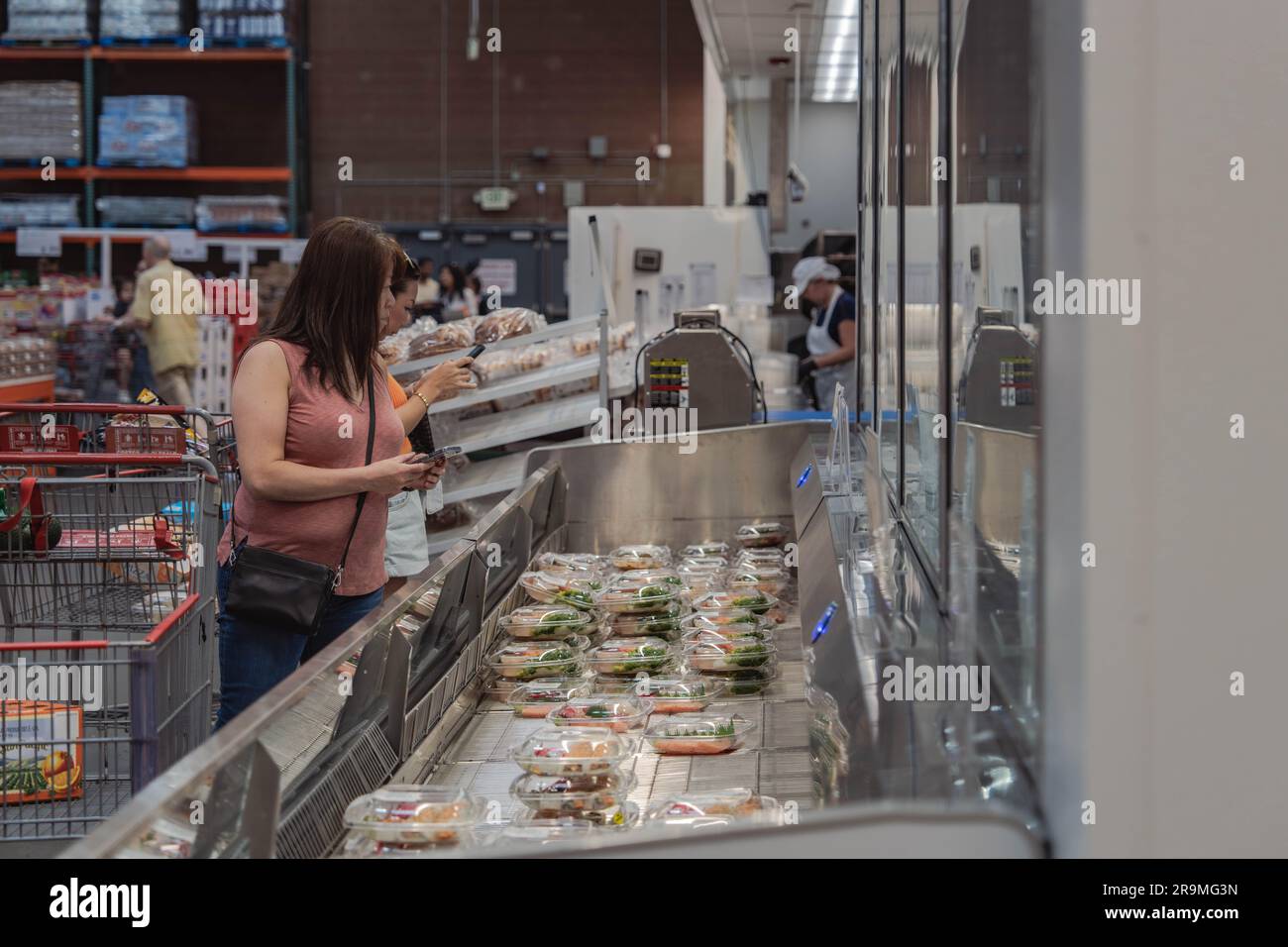 A vibrant image captures a bustling scene at a Costco food court ...