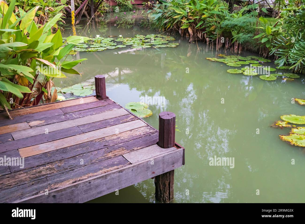 Farm Pond Piers Premium Photo | Wooden Boat On The Pond Near The Pier
