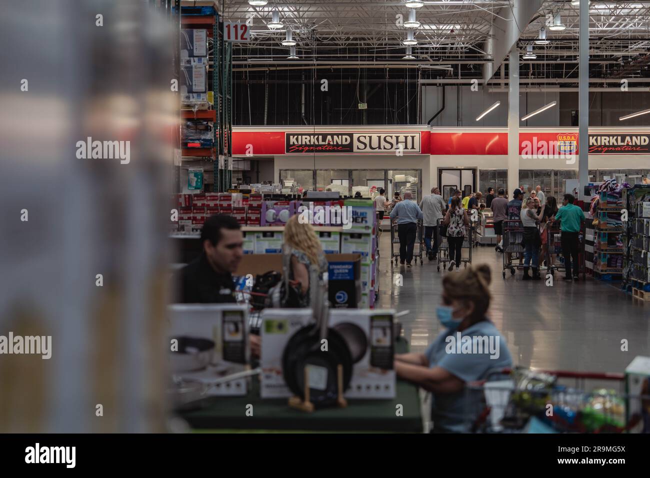 A vibrant image captures a bustling scene at a Costco food court ...