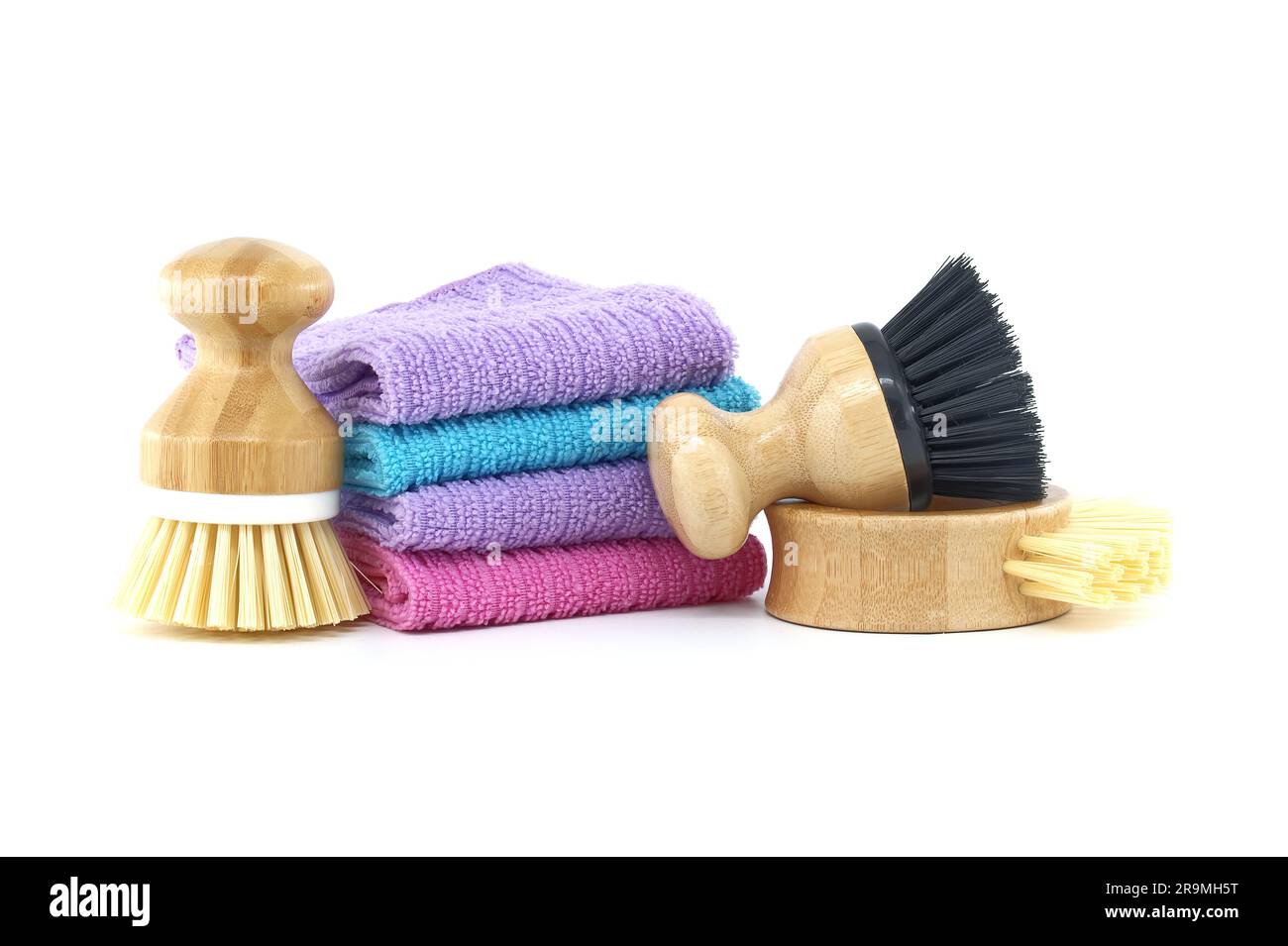 Group of assorted cleaning supplies including dishcloths in pastel ...