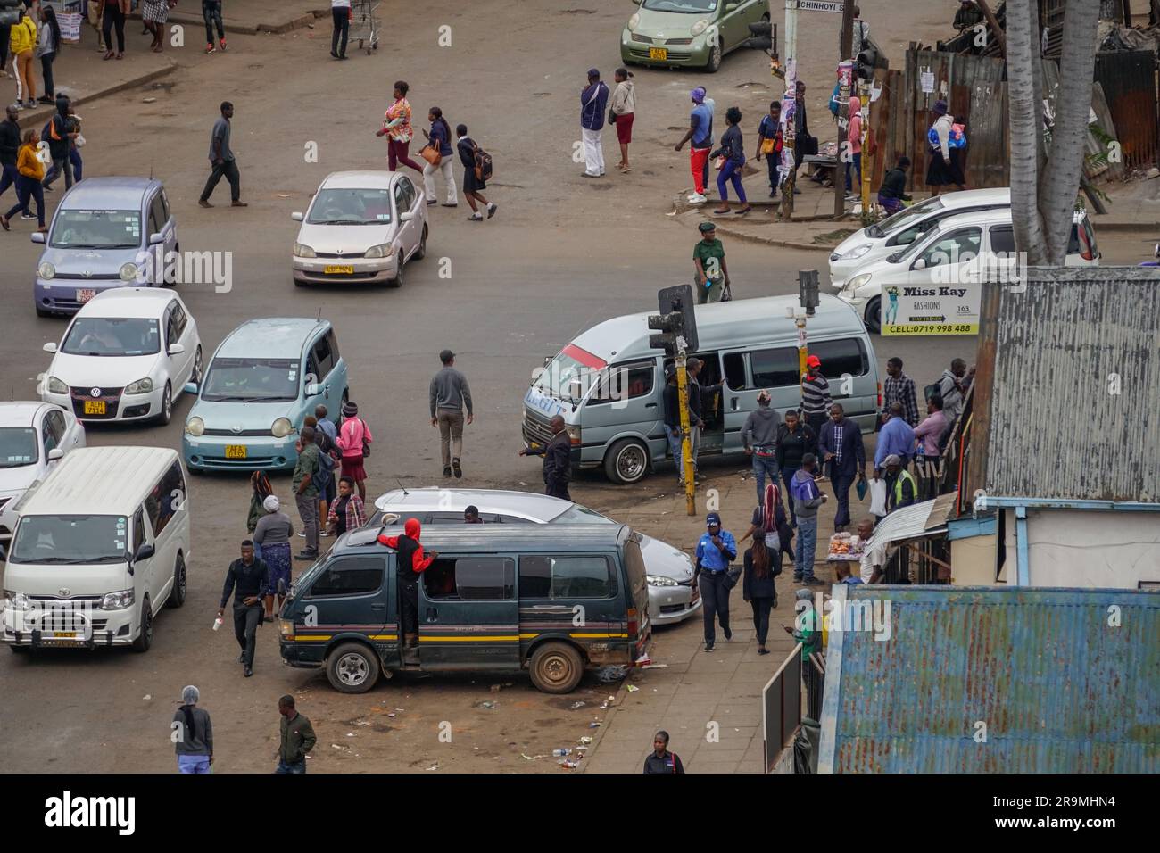 Passengers board unlicensed taxis, known as mshikashika, at ...