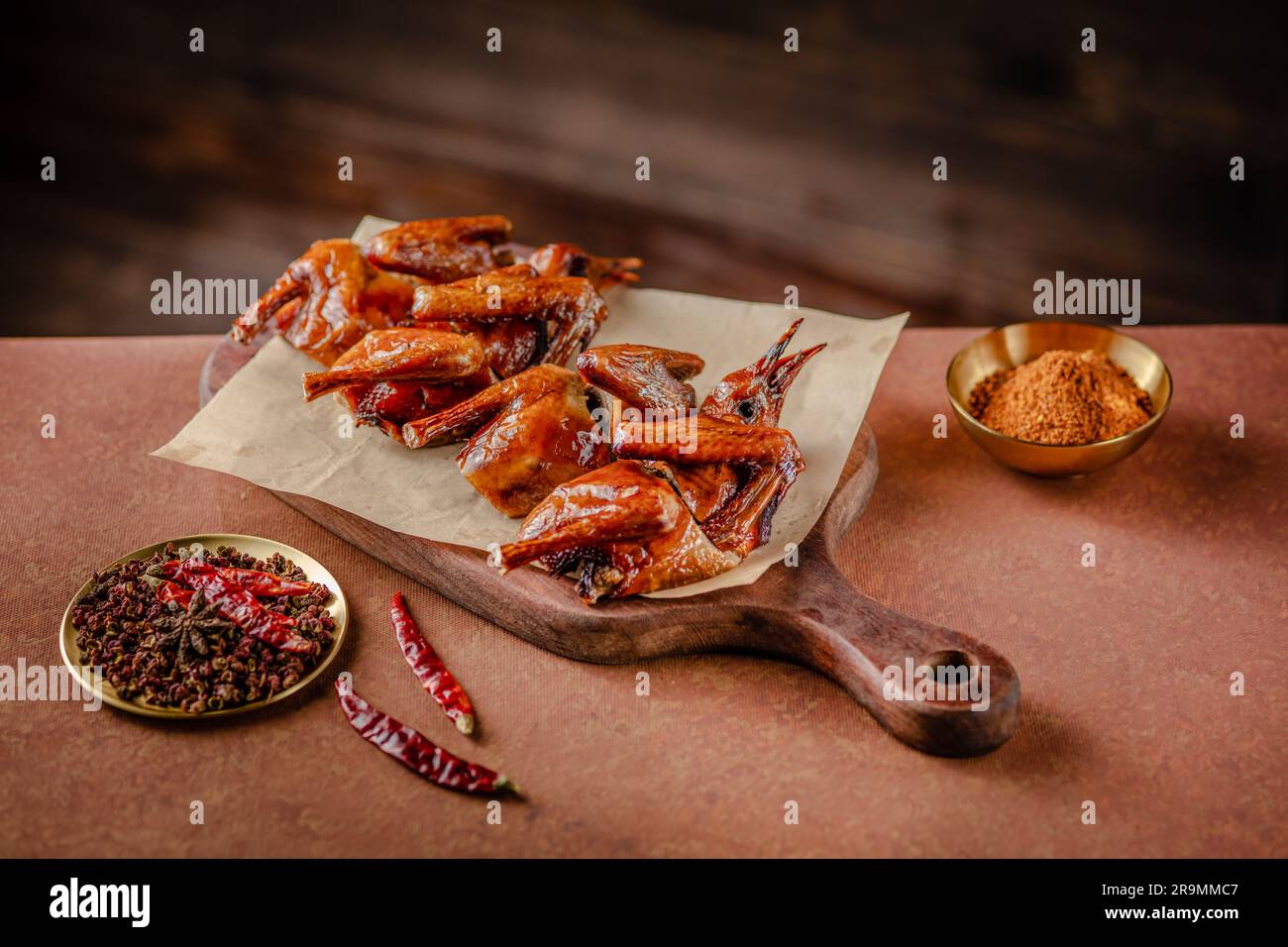 Traditional Cantonese grilled pigeon on a white porcelain plate，Crispy ...