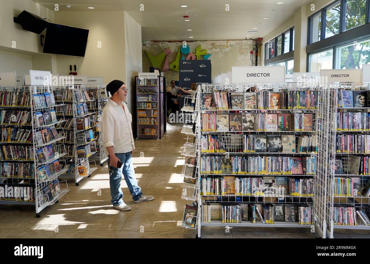A customer explores racks of videos at Vidiots Foundation, Tuesday, June 27, 2023, in Los ...