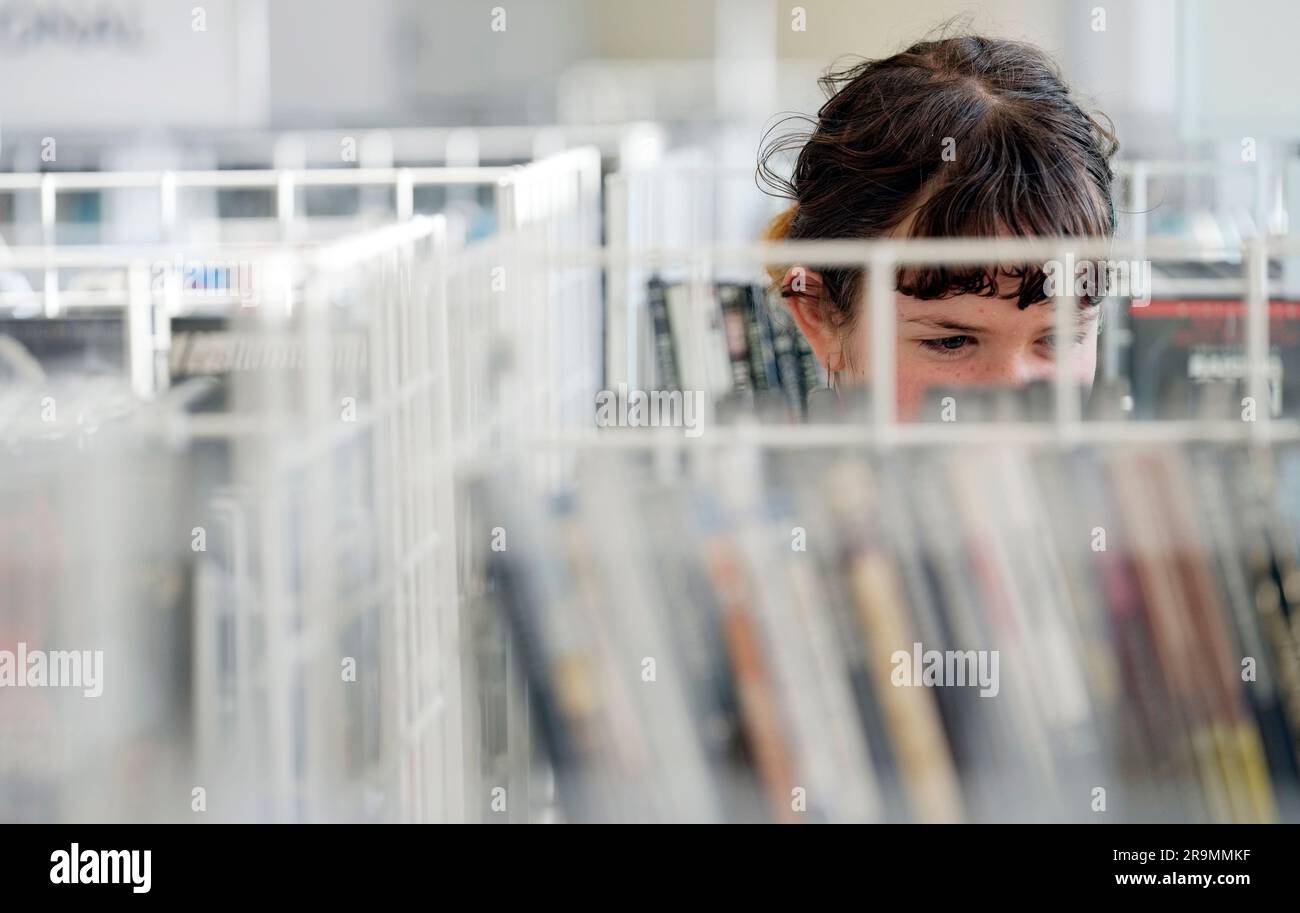 Customer Millie Haberman searches through stacks of videos at Vidiots ...