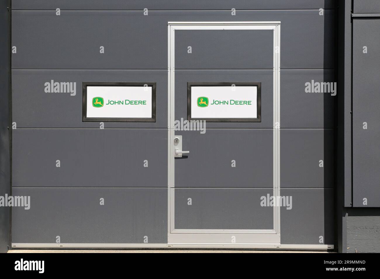 John Deere logo on the door and building exterior at the John Deere ...