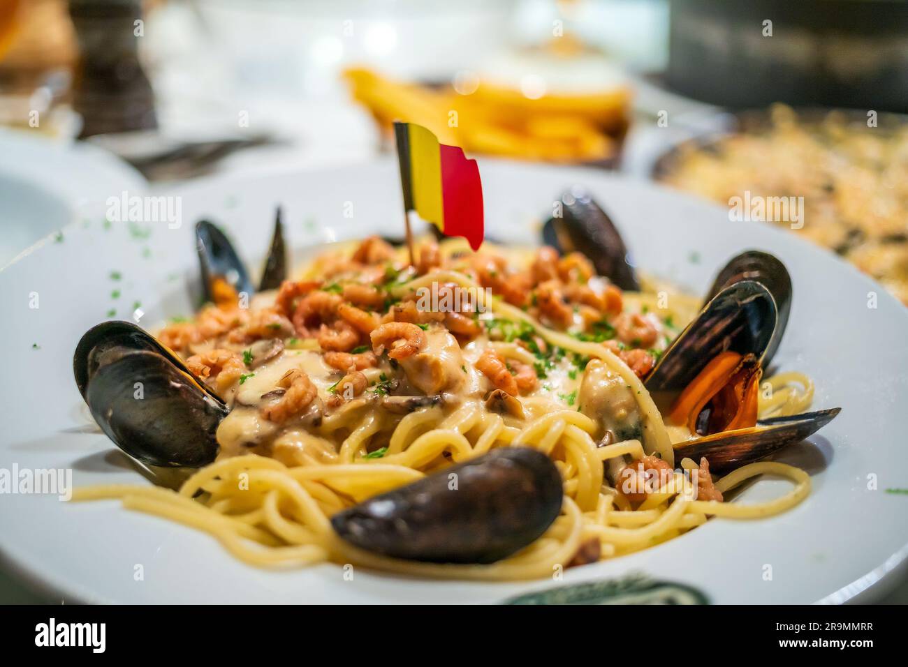 Traditional Belgian steamed mussels with pasta in Belgium Stock Photo ...