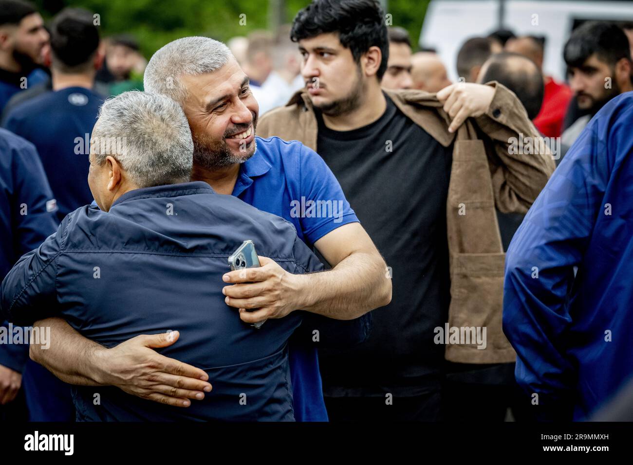 ROTTERDAM - Muslims after morning prayer in the Mevlana Mosque. This is ...