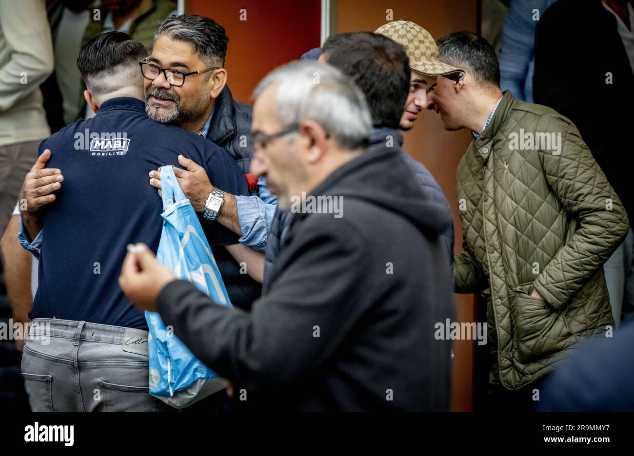 ROTTERDAM - Muslims after morning prayer in the Mevlana Mosque. This is ...