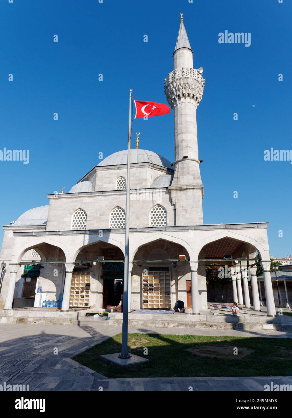 Entrance to the Şemsi Pasha Mosque with shoe racks in the ton of ...