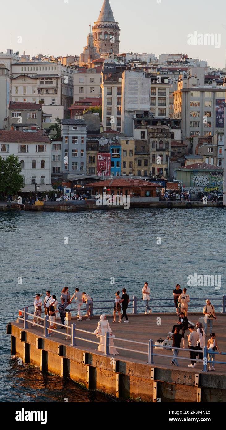 Tourists sightseeing on the Golden Horn River on a summers evening with ...