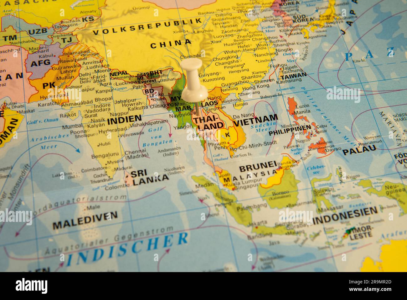A close-up shot of the map with a white push-pin marking Thailand Stock ...