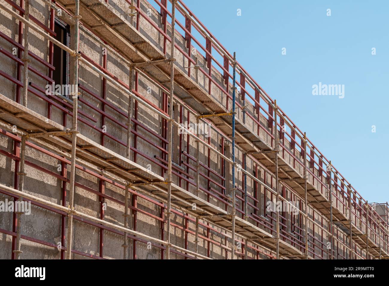 Construction scaffolding built on a new apartment building. new ...