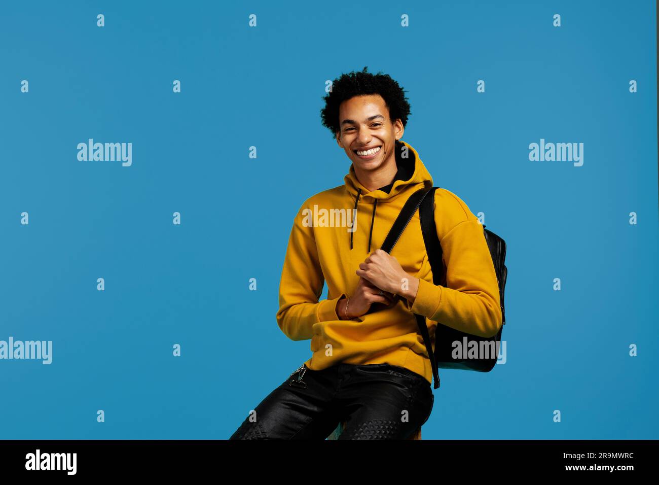student with backpack smiling ready for back to school Stock Photo - Alamy