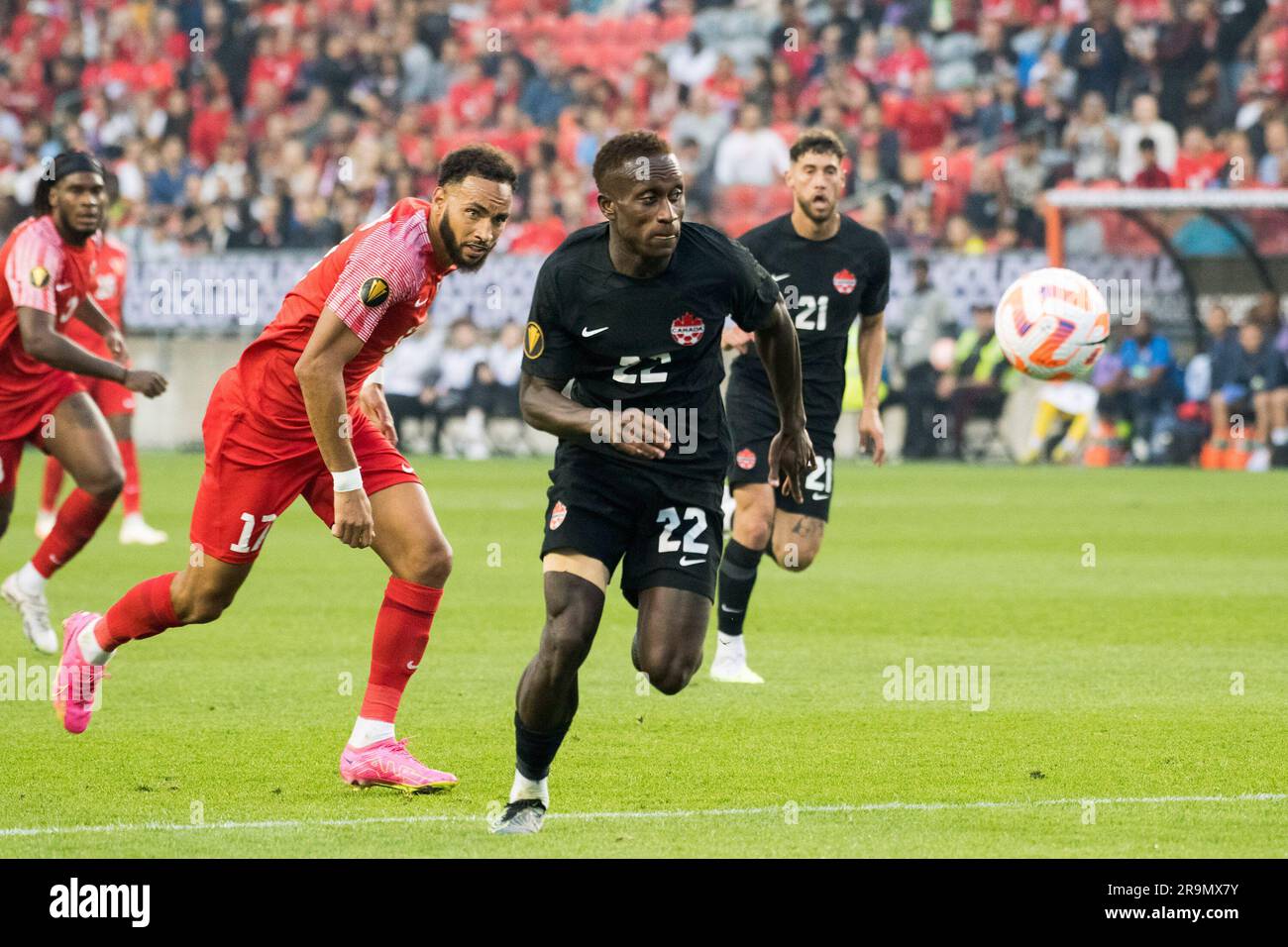Toronto, Canada. 27th June, 2023. Richie Laryea #22 (R) of Canada and ...
