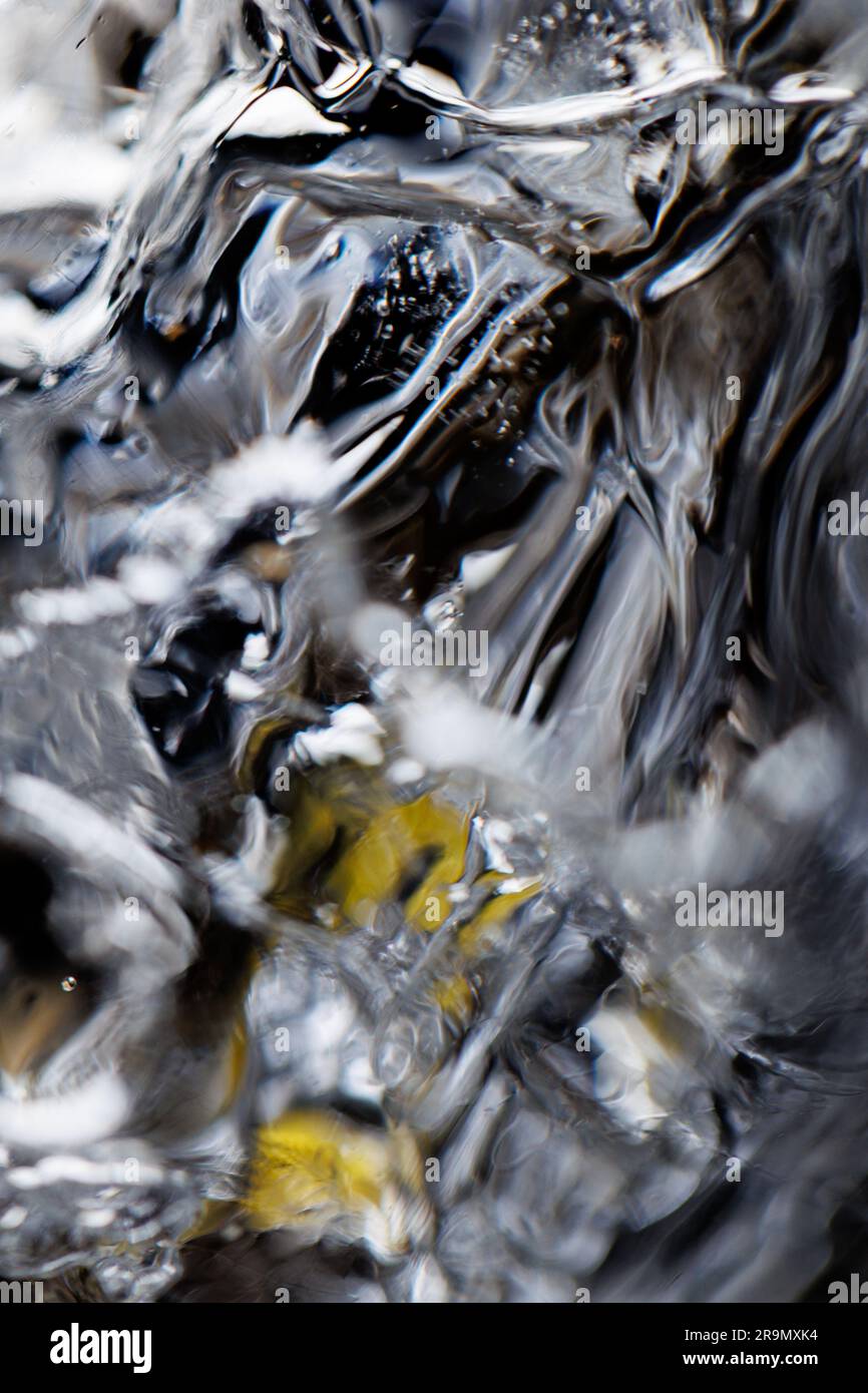 A vertical shot of clear water splashing wave motions Stock Photo - Alamy