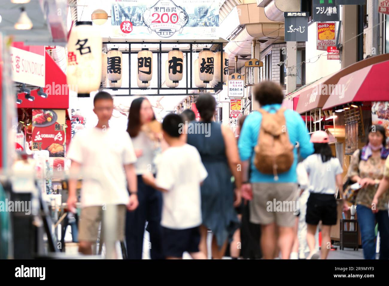 Foreign tourists visit at Kuromon Market (Kuromon Ichiba Fish Market ...